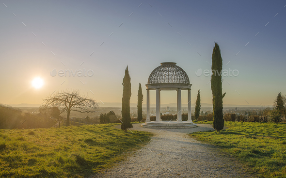 Beautiful view of a gazebo rotunda in a garden Stock Photo by wirestock