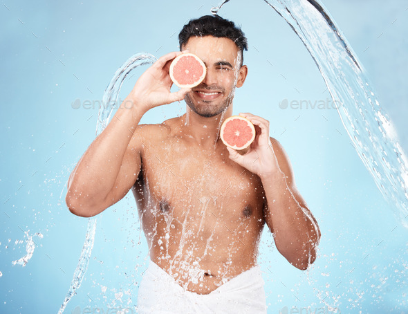 Skincare, beauty and water splash, man with fruit for vitamin c facial ...