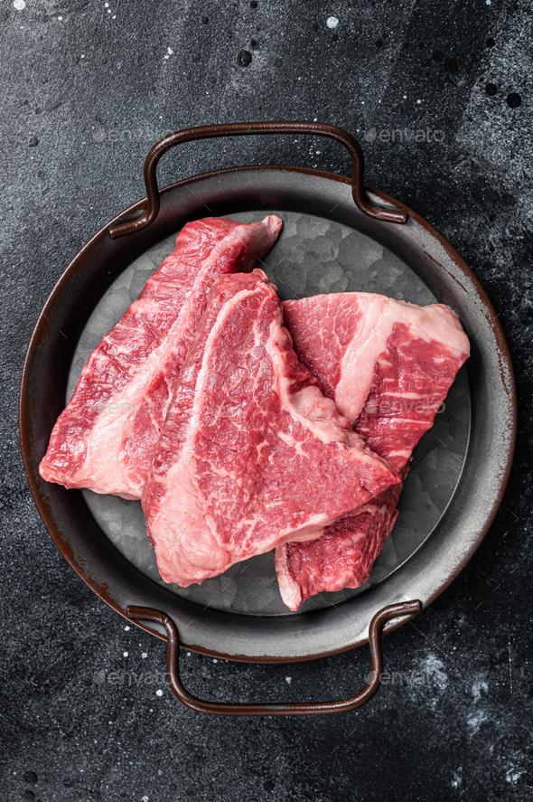 Raw Silverside sirloin beef steak cut on butcher tray. Black background ...