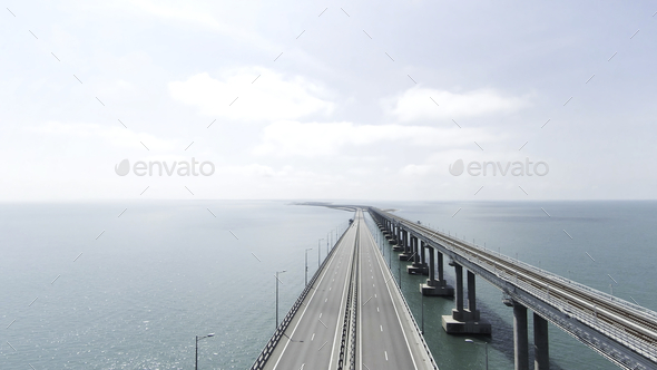 Top view of long bridge highway across sea. Action. Beautiful landscape ...
