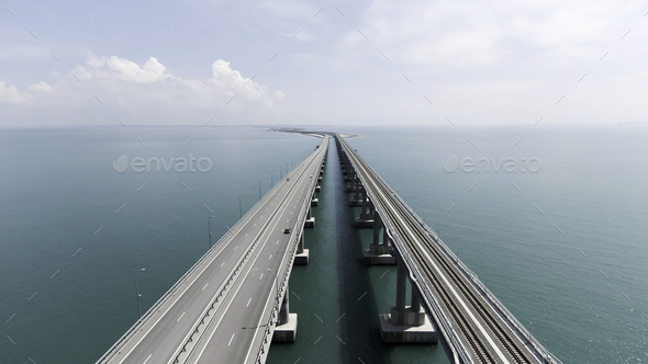 Aerial view along the long beautiful bridge above turquoise sea. Action ...