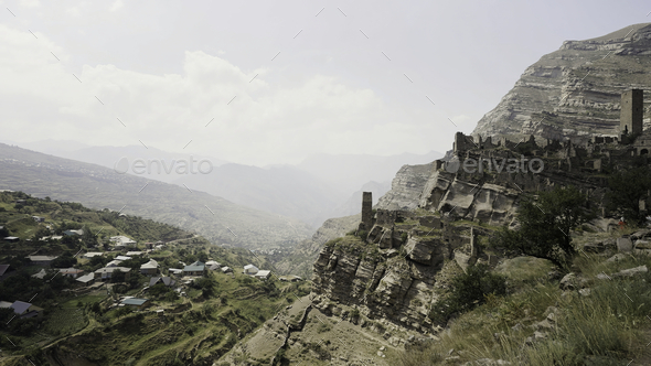 Ruins of ancient village with abandoned building stone walls on a ...