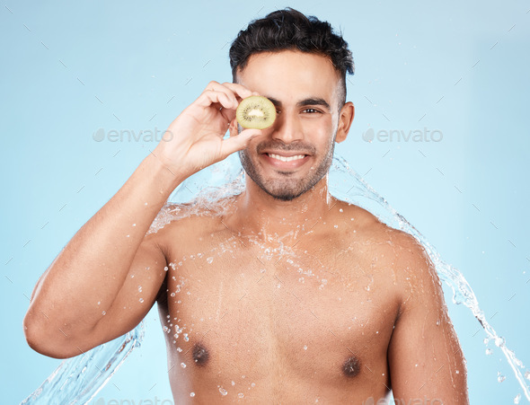 Skincare, beauty and water splash, man with fruit for vitamin c facial ...