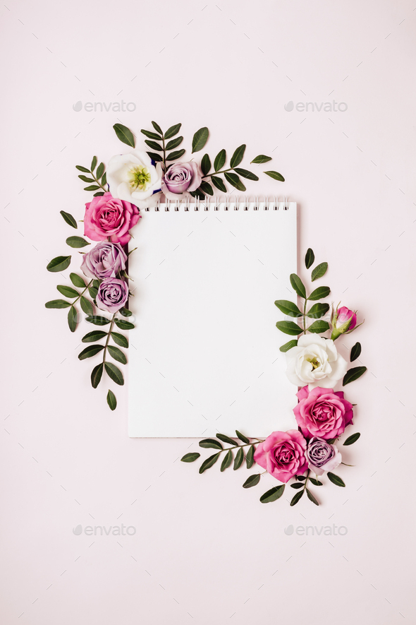 Notepad and floral frame on pink background. Spring Summer concept ...