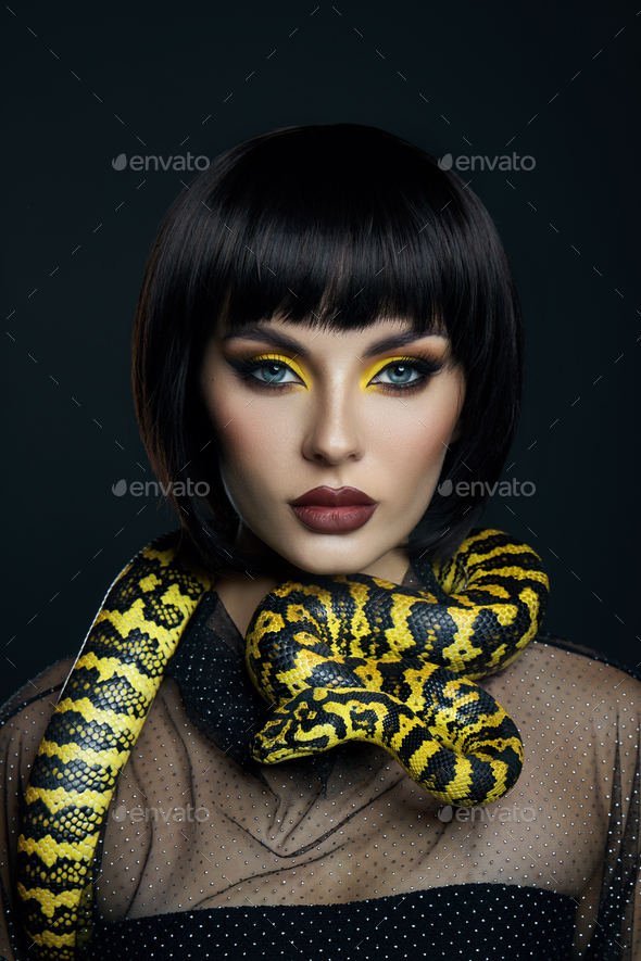 Beauty woman short haircut python yellow snake on her neck. A yellow ...