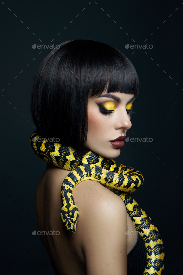 Beauty woman short haircut python yellow snake on her neck. A yellow ...