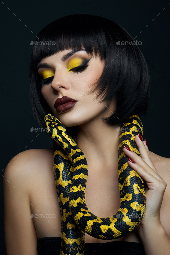 Beauty woman short haircut python yellow snake on her neck. A yellow ...