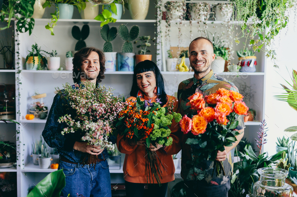 Team of florist work in flower store with teamwork spirit. Stock Photo ...