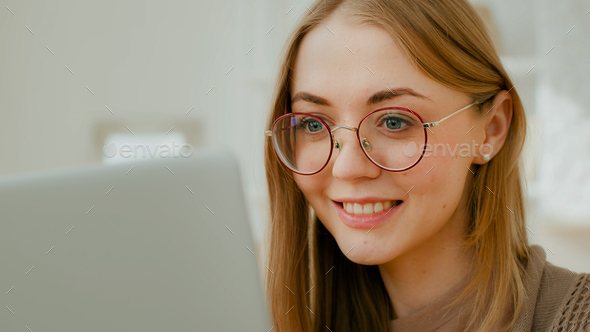 Close up Caucasian woman female face girl in glasses eyes look at ...