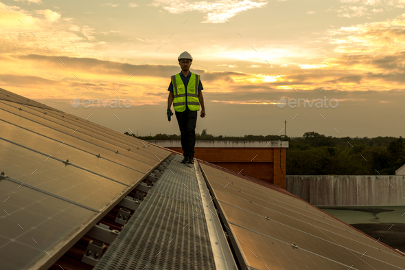 Engineer working setup Solar panel at the roof top. Stock Photo by kckate16