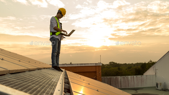 Engineer working setup Solar panel at the roof top. Stock Photo by kckate16