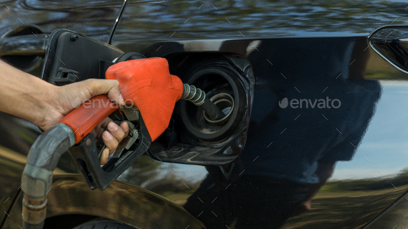 Refill and filling Oil Gas Fuel at station. Gas station - refueling ...