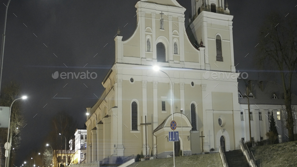 Old Catholic Church in night city. Action. Beautiful light temple ...