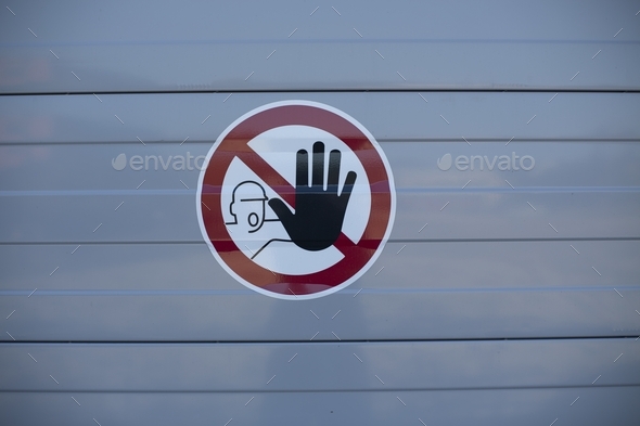 Sticker of a stop sign on a light blue wall in a construction site ...