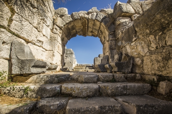 Wide shot of ancient stone structures in the ancient city of Miletus in Turkey Stock Photo by ...