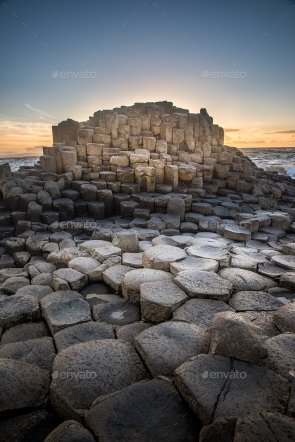 Vertical shot of a curious rock formation with hexagonal segments next ...