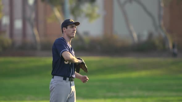 A young man playing catch with a baseball., Stock Footage | VideoHive