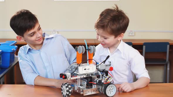 Two Brothers Kids Playing with Robot Toy at School Robotics Class ...