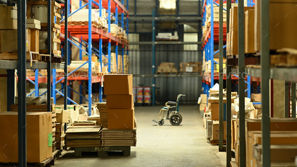Image of a wheelchair in large logistic distribution warehouse full of ...