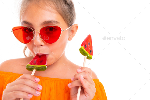 charming teenager girl with chupachups in the form of watermelons on ...