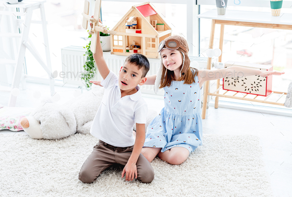 Smiling little friends flying wooden plane Stock Photo by tan4ikk ...
