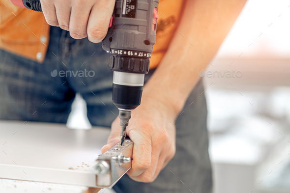 Man working during process of furniture manufacturing Stock Photo by ...