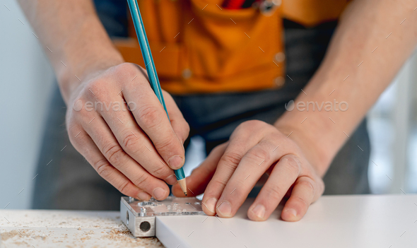 Man working during process of furniture manufacturing Stock Photo by ...