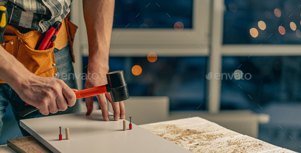 Man working during process of furniture manufacturing Stock Photo by ...