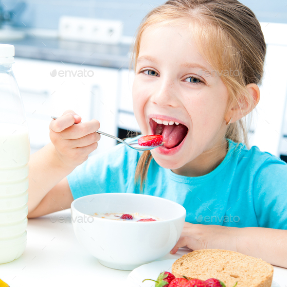 little girl eating Stock Photo by tan4ikk | PhotoDune