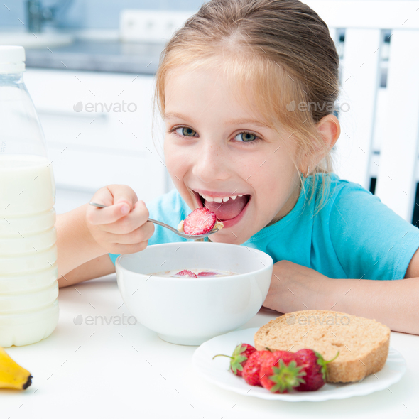 little girl eating Stock Photo by tan4ikk | PhotoDune