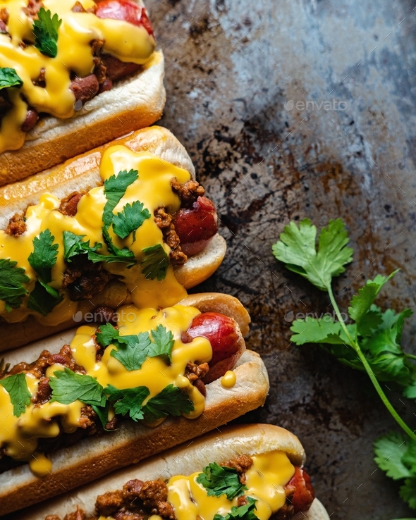 Vertical high angle closeup shot of delicious hot dogs with yellow ...
