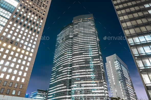 Low angle of the Shiodome City Center at night in the Shiodome area of ...