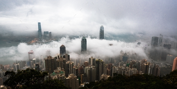 Skyscrapers of a city covered in mist Stock Photo by wirestock | PhotoDune