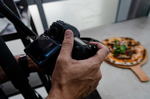 Food photographer is shooting pizza Stock Photo by wirestock | PhotoDune