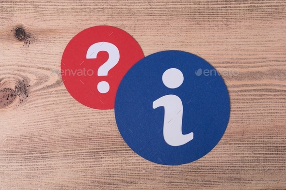Round information and question signs and a wooden floor on the ...