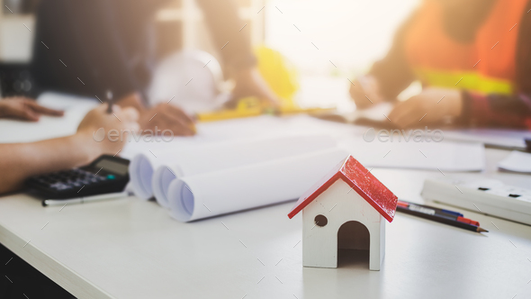 Businessman, construction project owner and engineer planning and ...