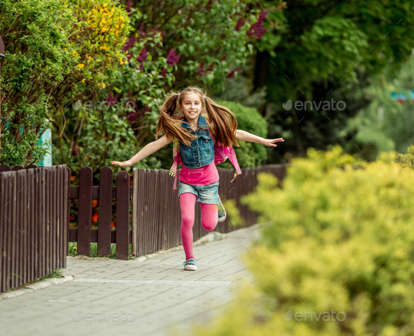 little girl run from school Stock Photo by tan4ikk | PhotoDune