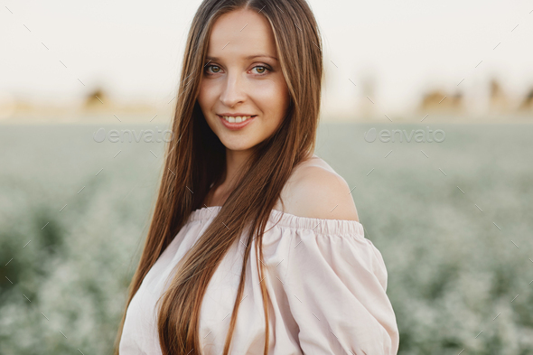 Beautiful woman enjoying field, happy young lady and spring green ...