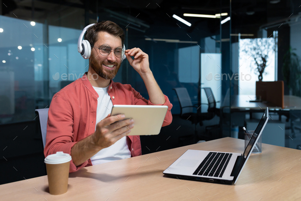 Successful businessman at workplace smiling man watching online video ...