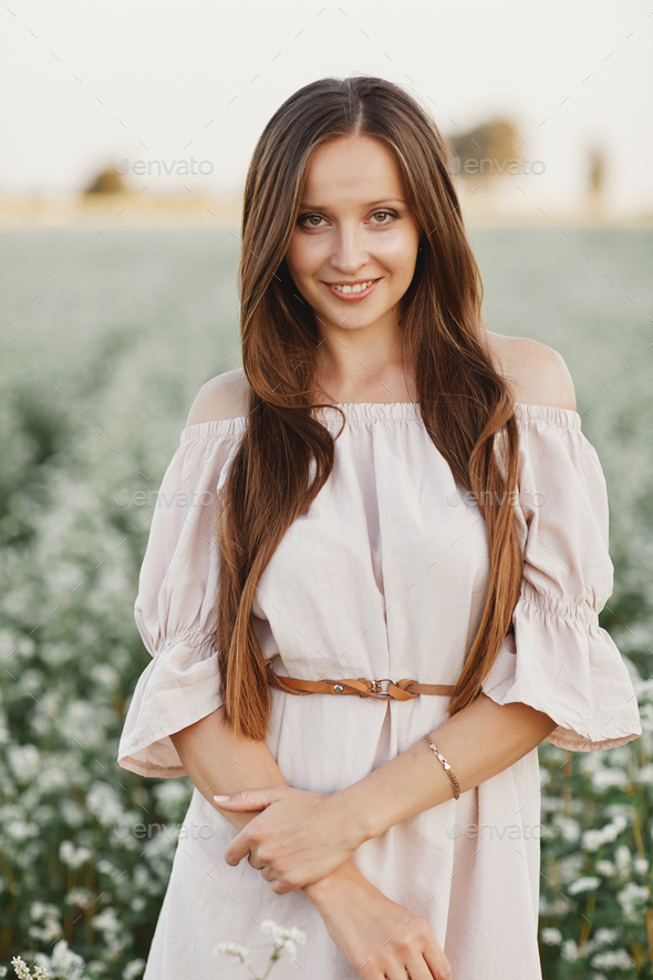 Beautiful woman enjoying field, happy young lady and spring green ...