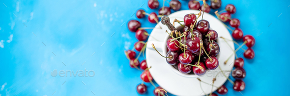 Cherry banner background. Red summer cherry berries in a cup on a ...