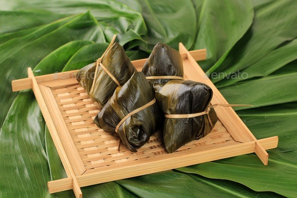 Zongzi or Bakcang. Chinese savoury sticky rice dumplings in bamboo ...