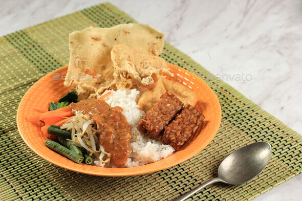 Nasi Pecel. Traditional Javanese Rice Dish of Steamed Rice with ...
