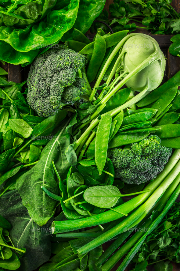 Green organic vegetables and dark leafy food background Stock Photo by ...