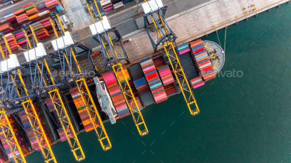Container ship loading and unloading at deep sea port, Aerial view of global business logistic ...