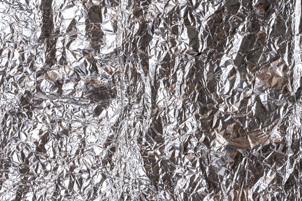 Crumpled sheet of gray foil, packaging material Stock Photo by ndanko