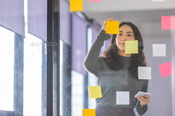 Business female employee with many conflicting priorities arranging ...