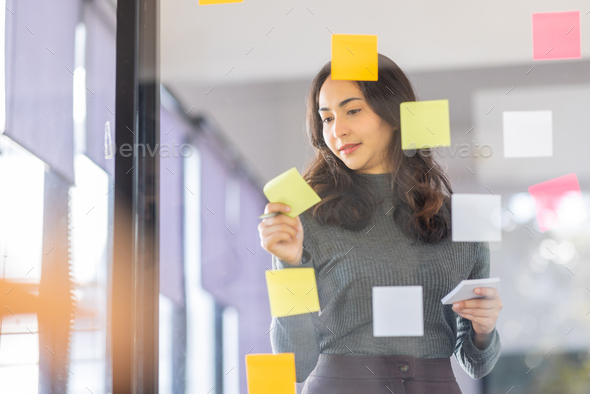 Business female employee with many conflicting priorities arranging ...