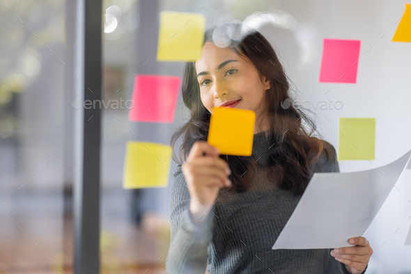 Business female employee with many conflicting priorities arranging ...