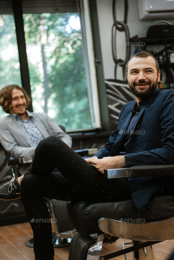 portrait of a male groom in a blue suit in the morning barbershop Stock ...